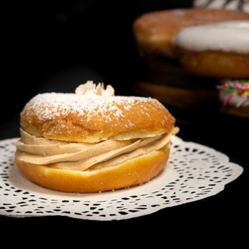 White Zebra Iced Raised Ring Donuts - Prantl's Bakery